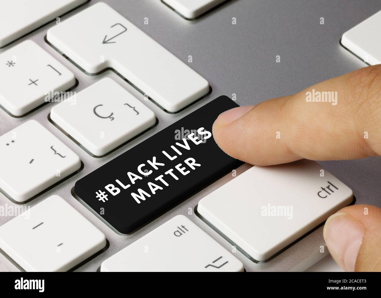 #Black Lives Matter Written on Black Key of Metallic Keyboard. Finger ...