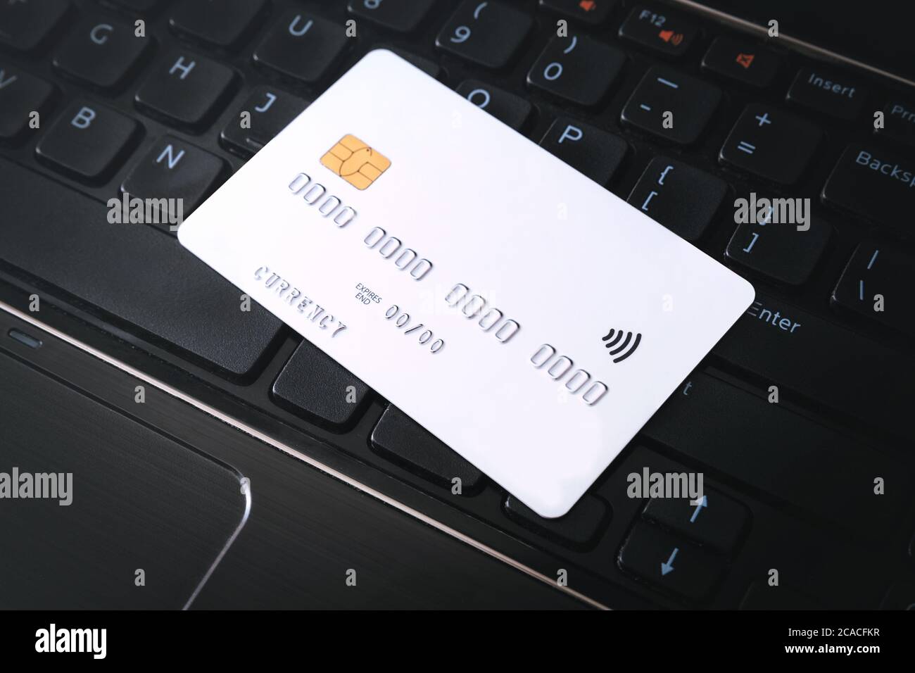 Close up of white credit/debit or online bank card mockup, on top of ...