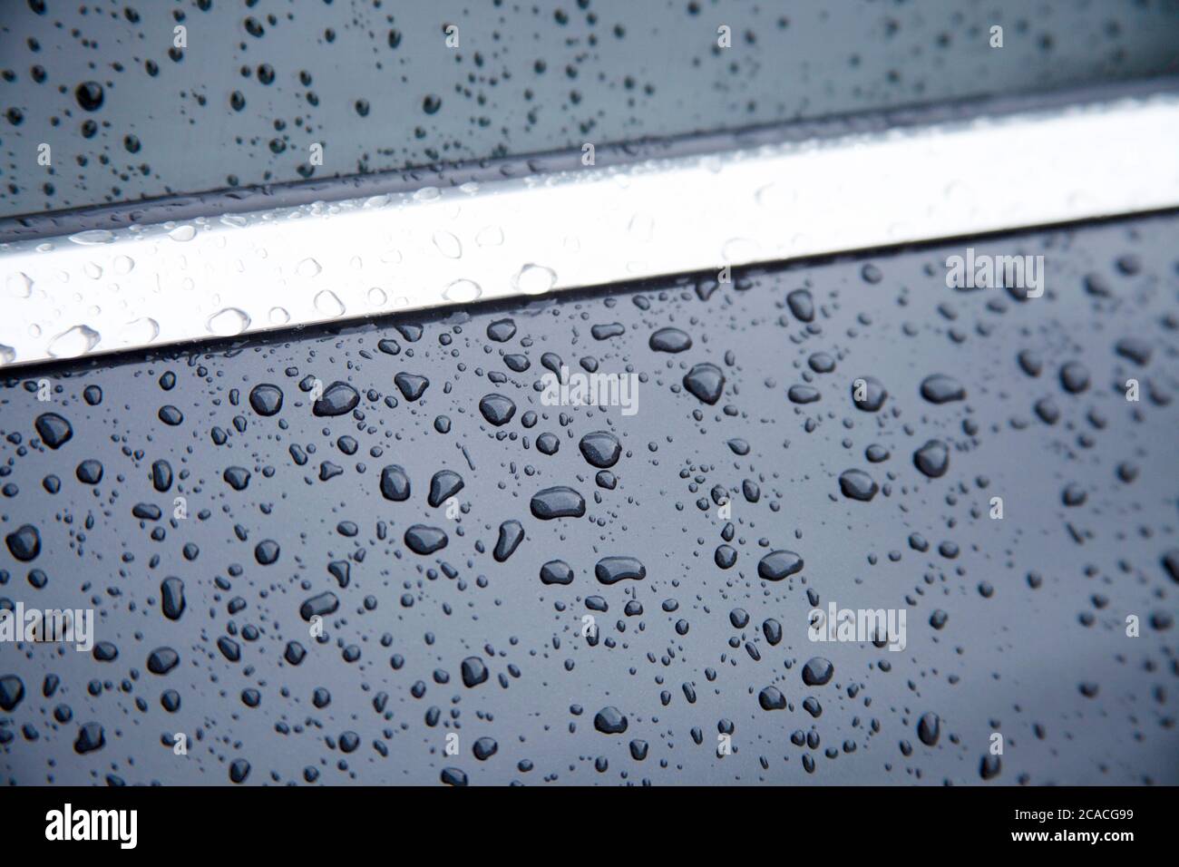 Water drops collect on top of metallic car surface Stock Photo - Alamy