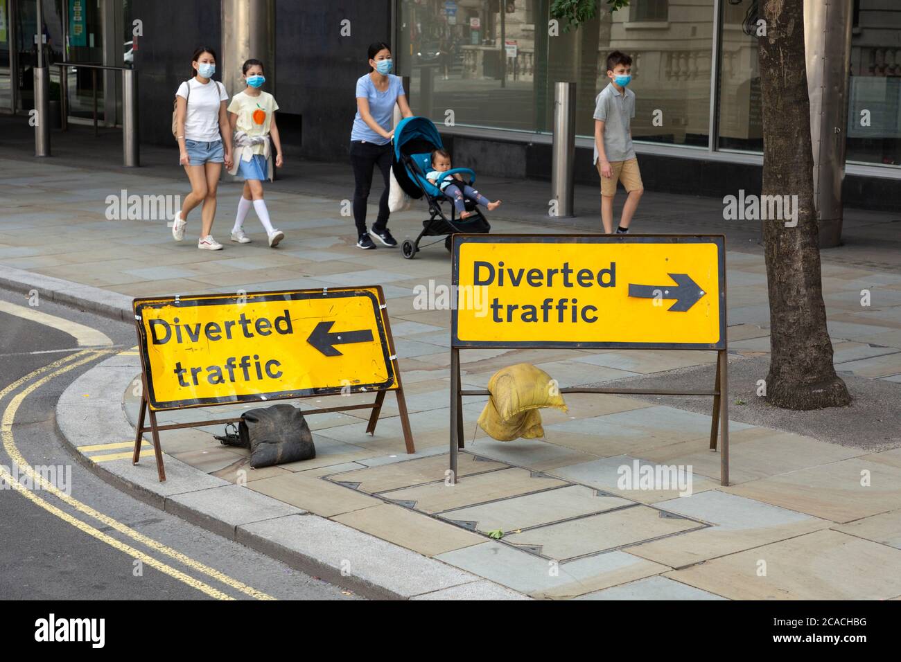 Diverted traffic road signs on the pavement, London Stock Photo - Alamy