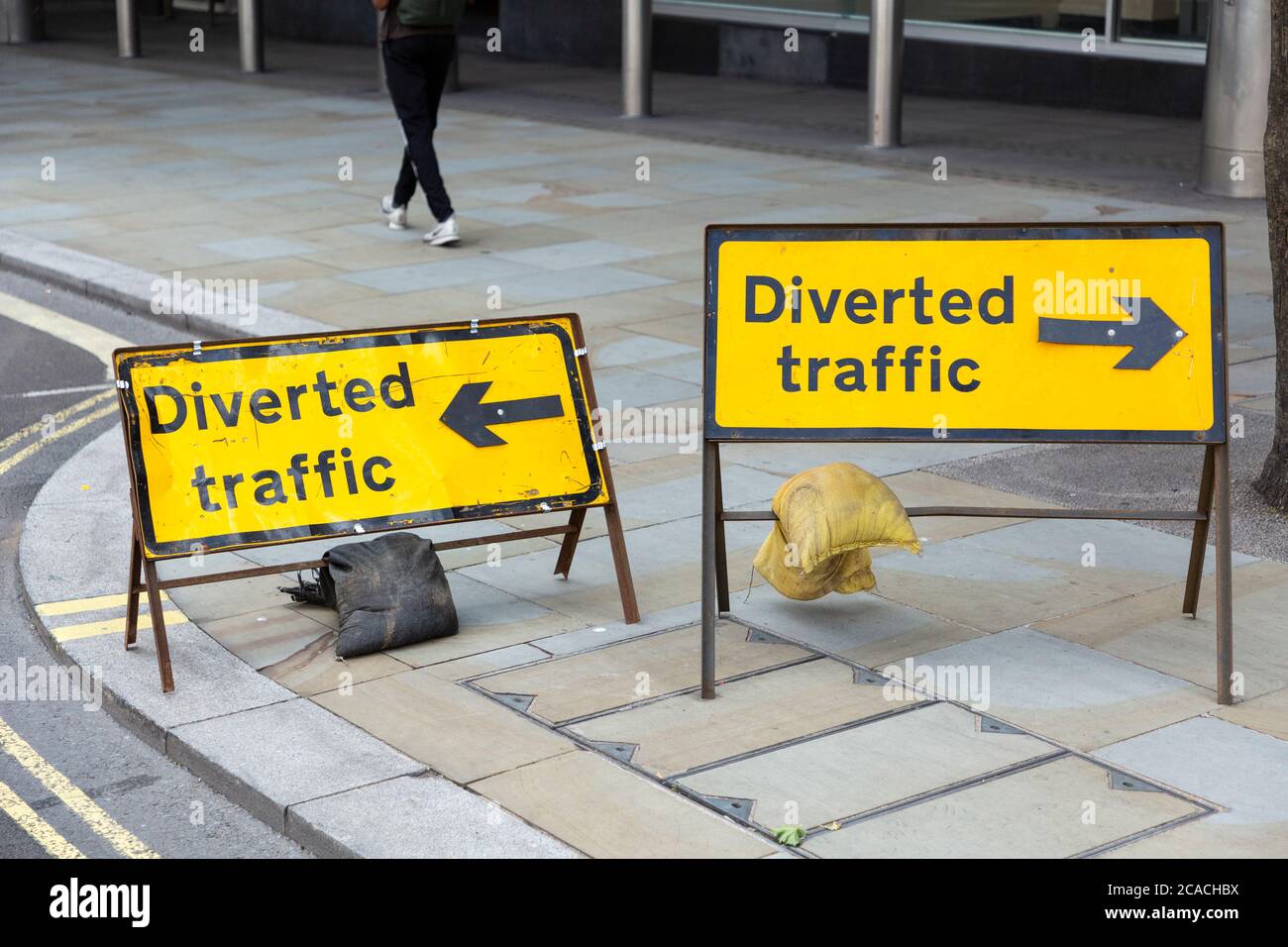 Diverted traffic road signs on the pavement, London Stock Photo - Alamy