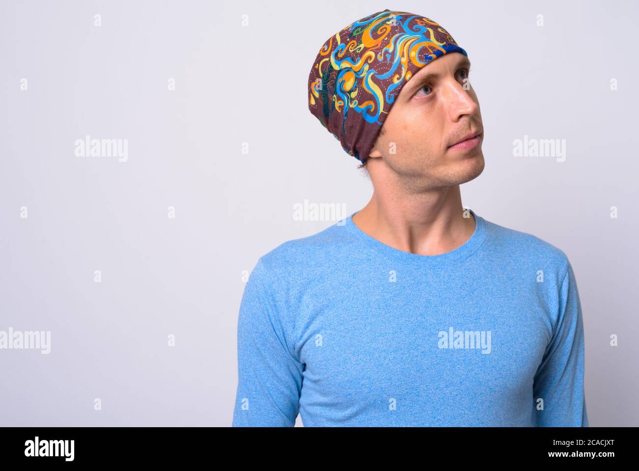 Portrait of man wearing beanie against white background Stock Photo - Alamy