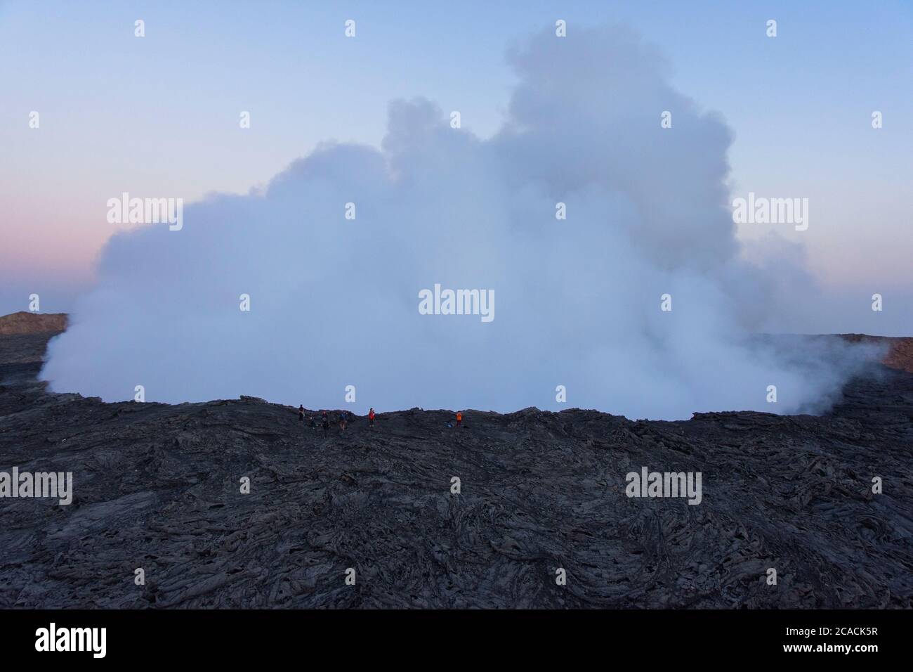 Group of people at the edge of Erta Ale volcanic crater, Ethiopia Stock ...