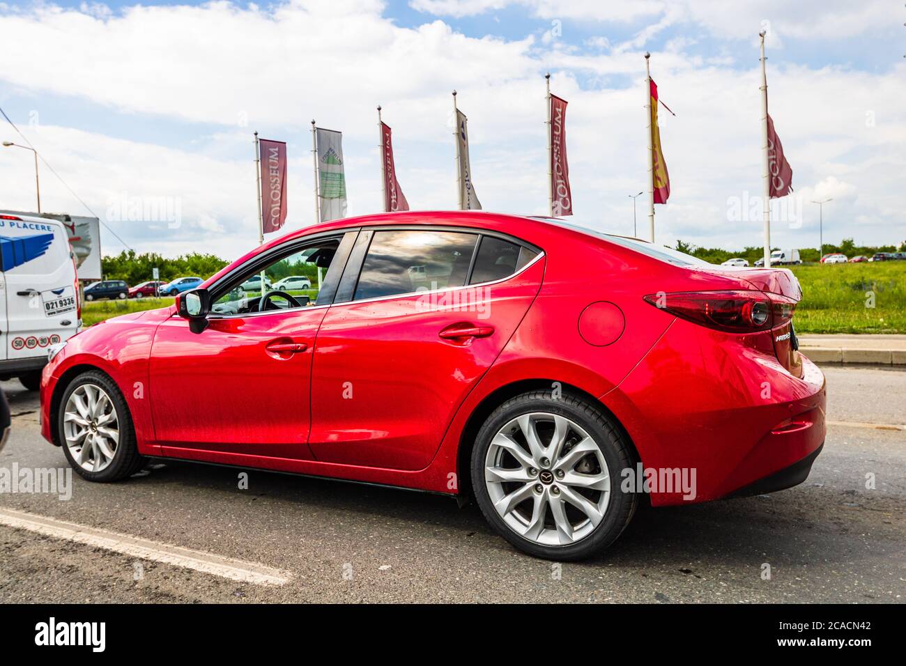 Traffic with road view through car front window, Red mazda 3 car in ...