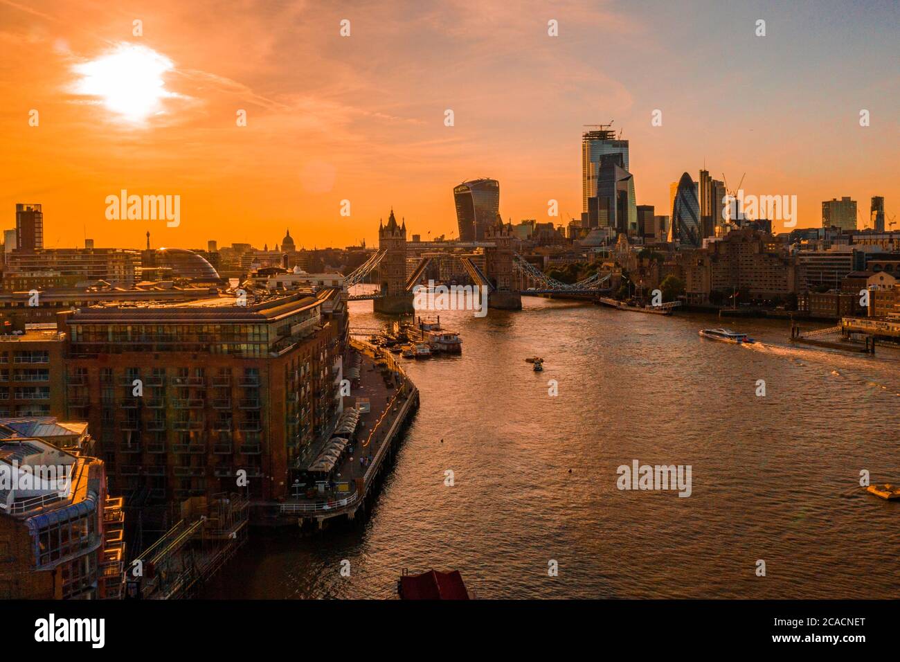 Beautiful sunset over Tower Bridge in London, UK - Tower Bridge lifting ...