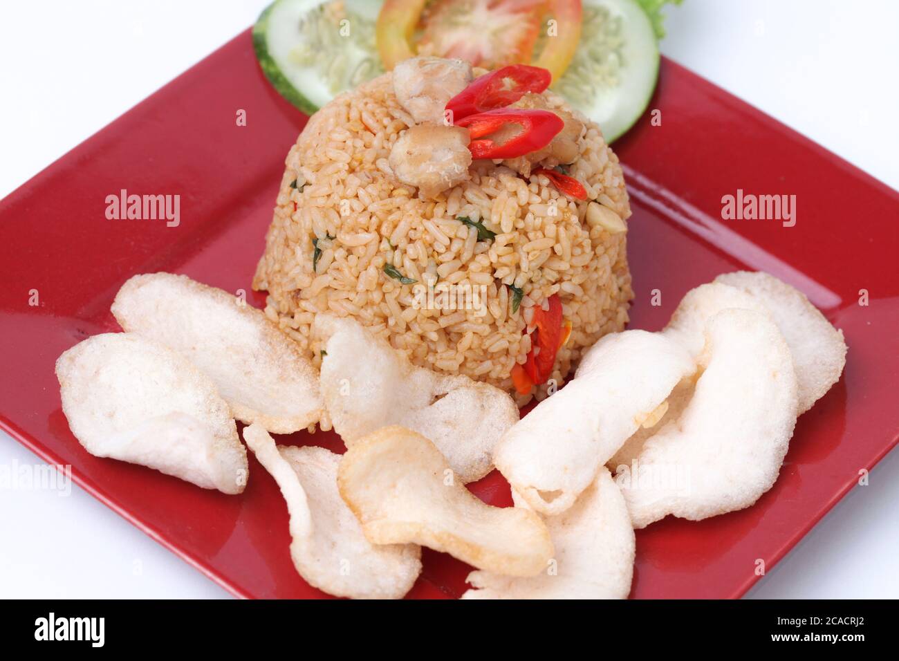 Indonesian dish : fried rice ( nasi goreng) served prawn crackers ...
