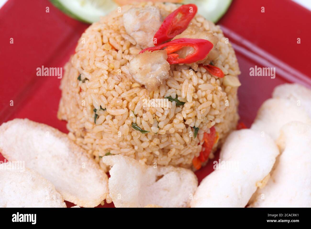 Indonesian dish : fried rice ( nasi goreng) served prawn crackers ...
