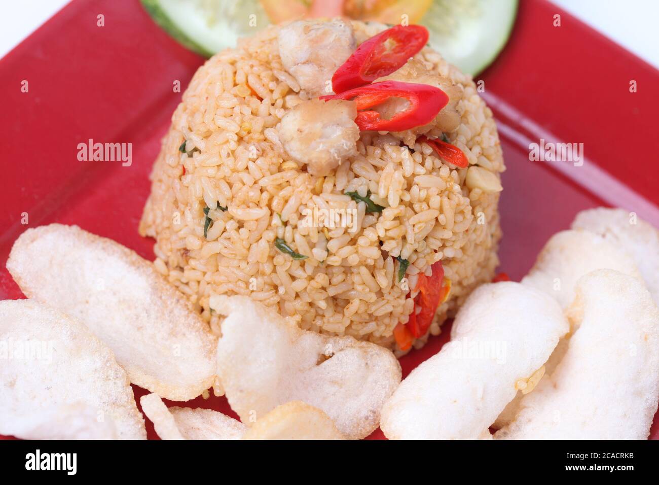 Indonesian dish : fried rice ( nasi goreng) served prawn crackers ...
