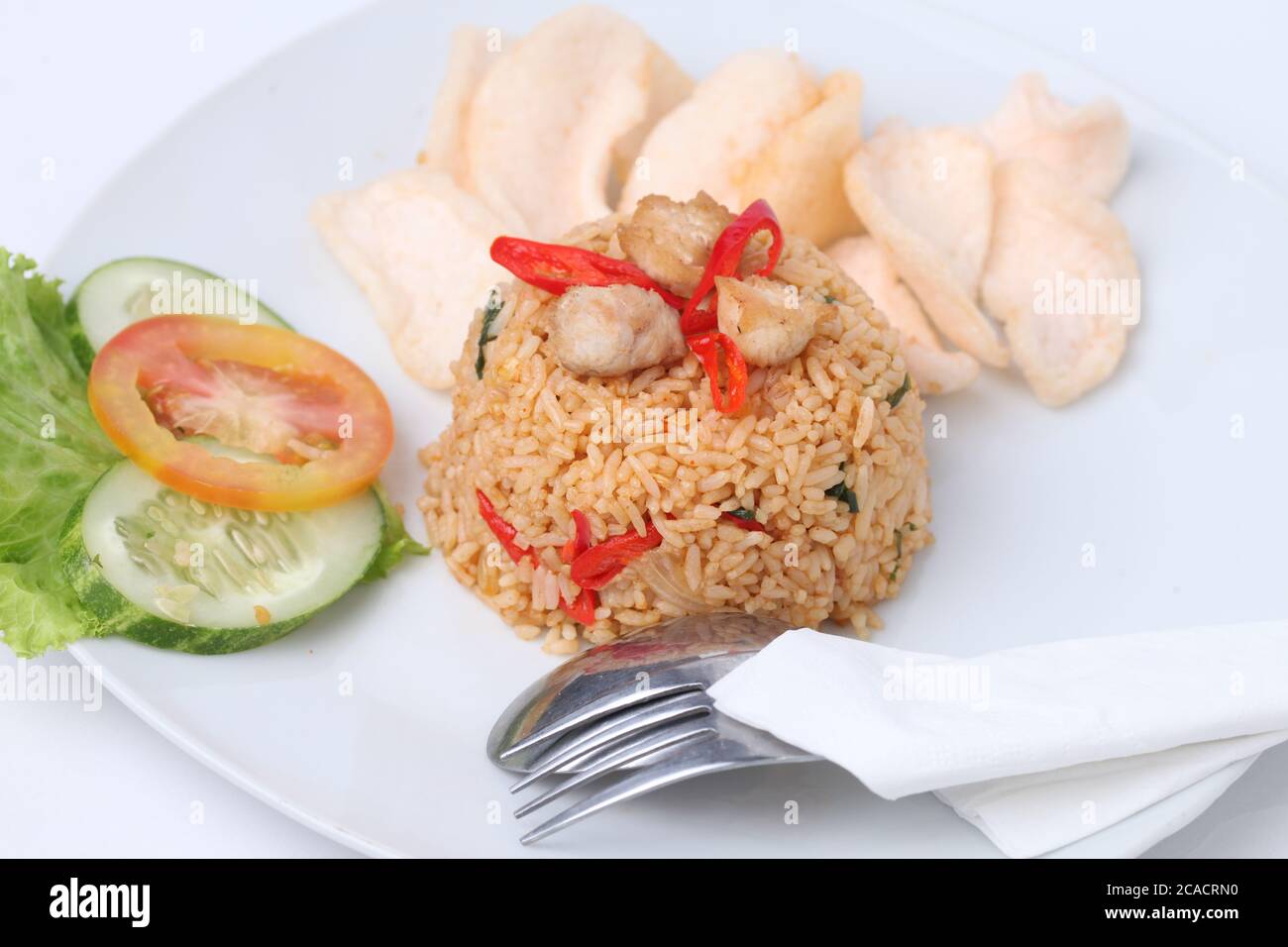 Indonesian dish : fried rice ( nasi goreng) served prawn crackers ...