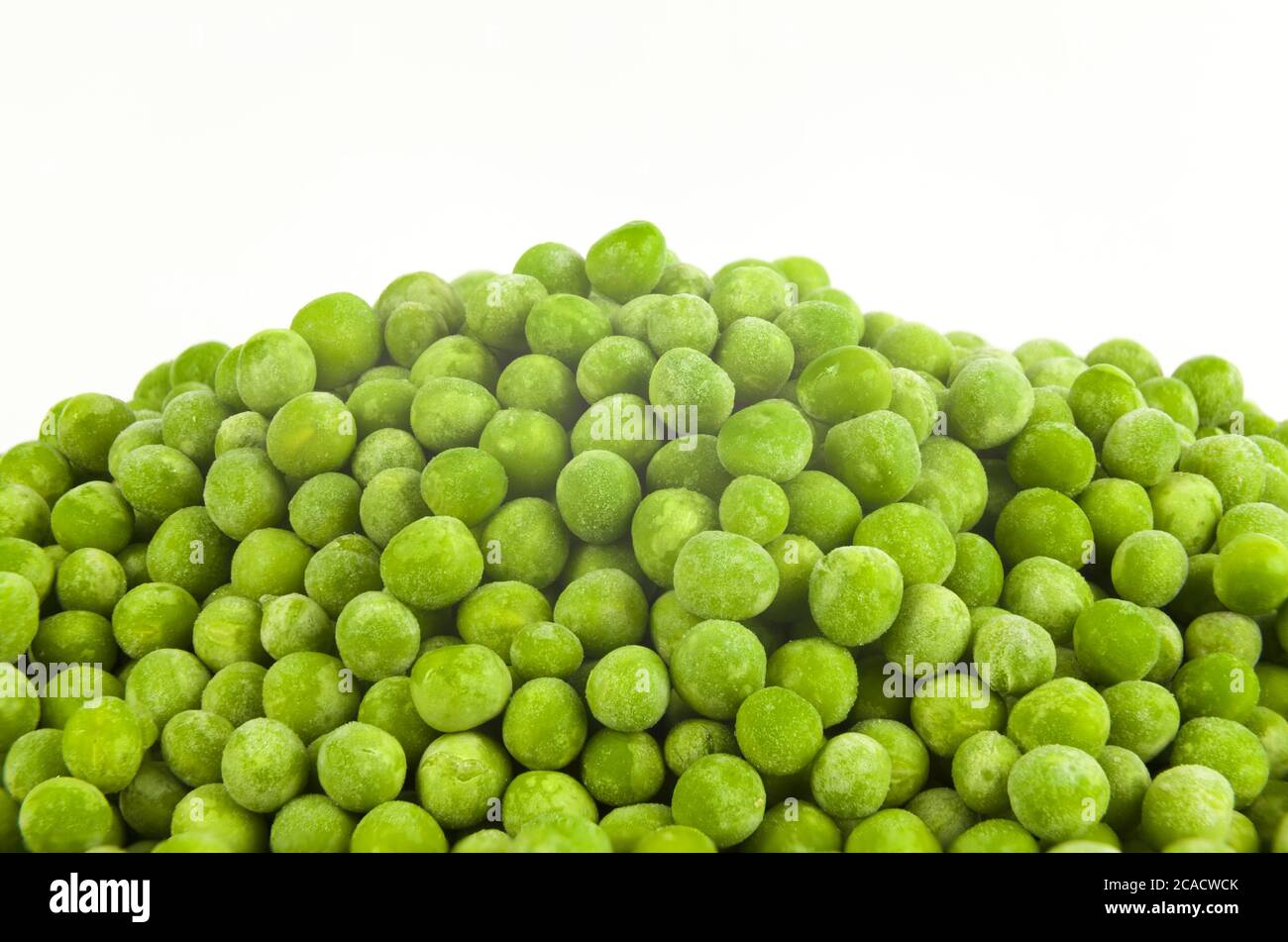 frozen peas isolated on white Stock Photo - Alamy