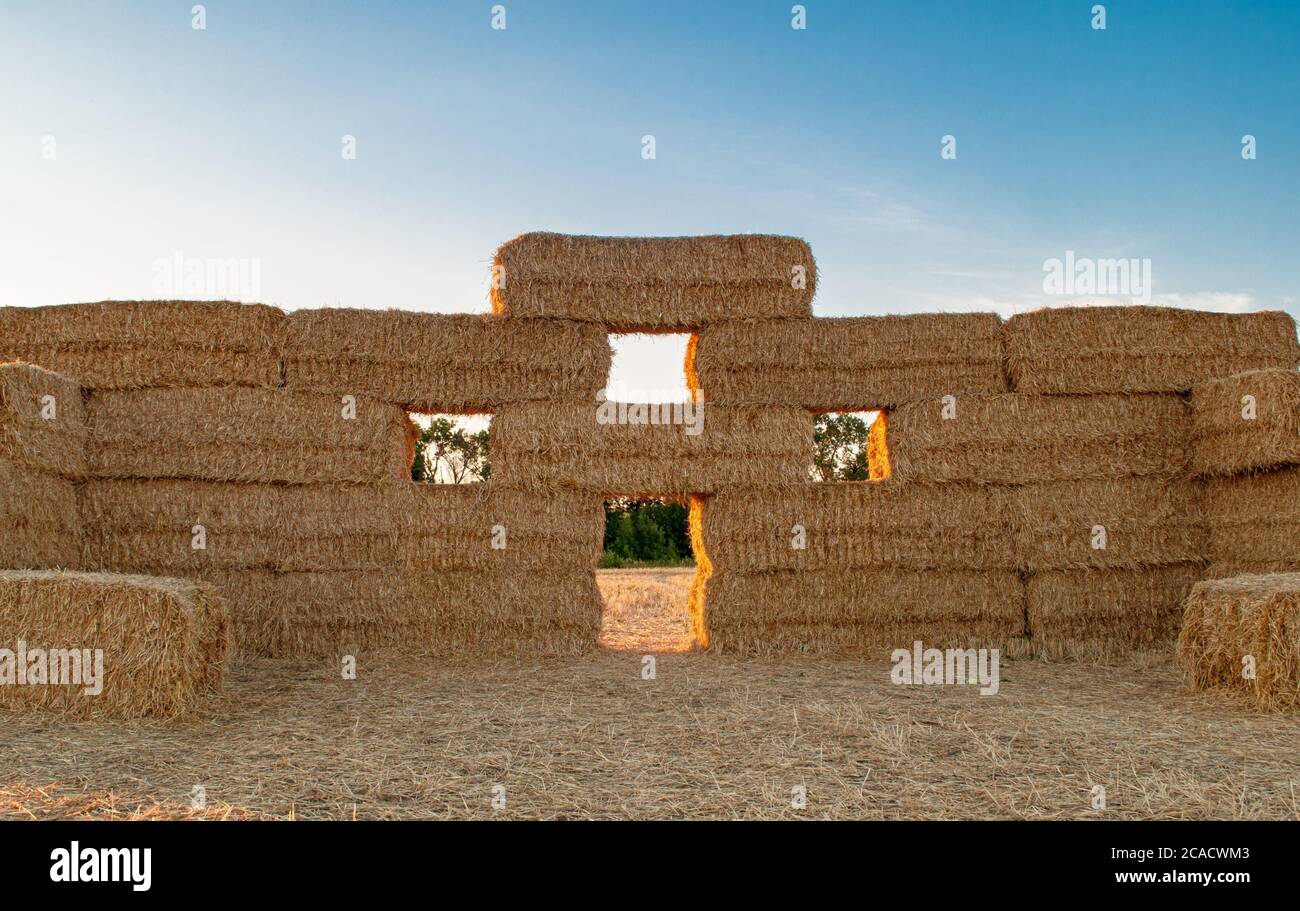 dry stack of straw stacked on top of each other in the form of a castle ...
