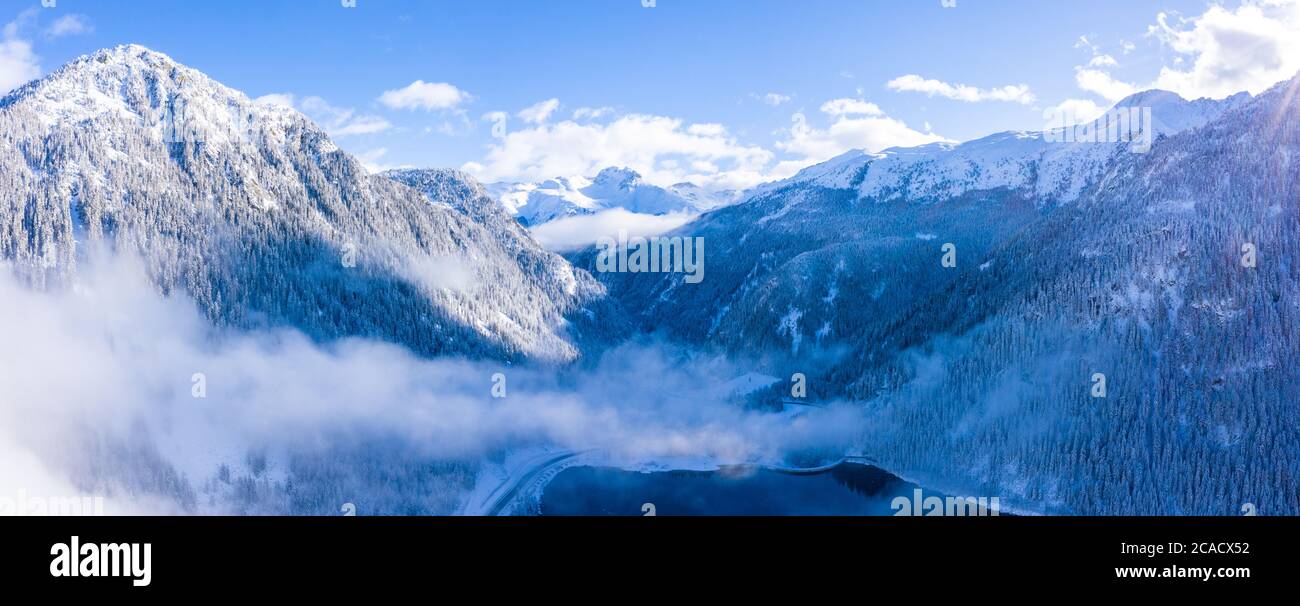 Beautiful scenery of a forest in the snowy Alps in winter Stock Photo ...