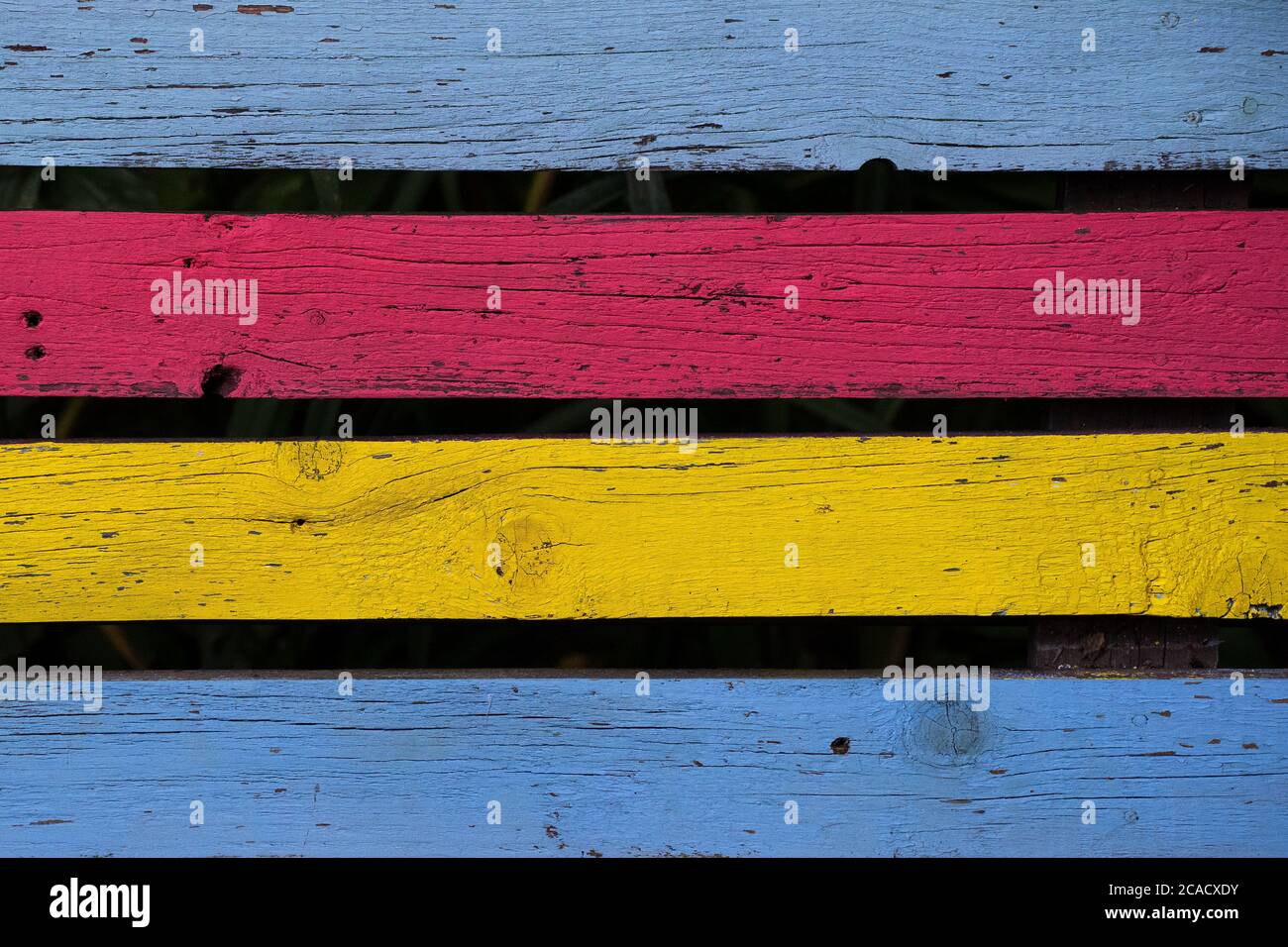 front view closeup of horizontal wood timber planks colored in red ...