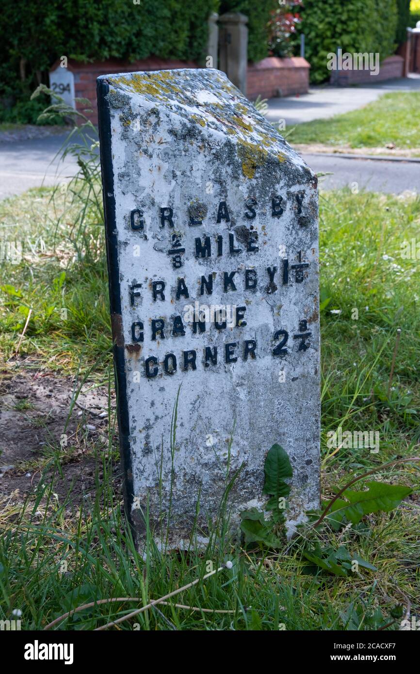 Stone mile marker by side of main road in Greasby Wirral May 2020 Stock ...