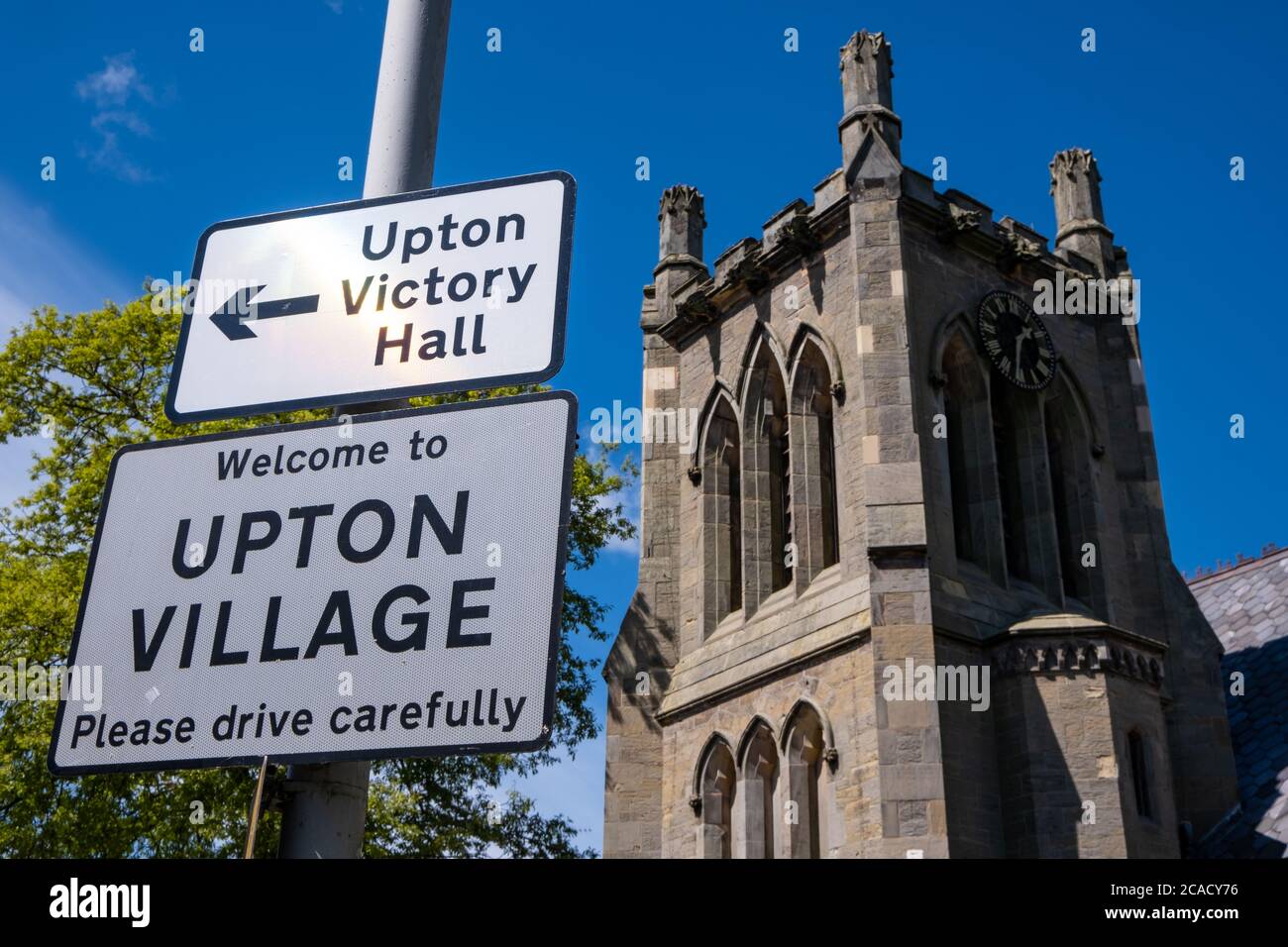 Welcome to Upton sign with tower of St Marys Church in Upton Wirral May ...