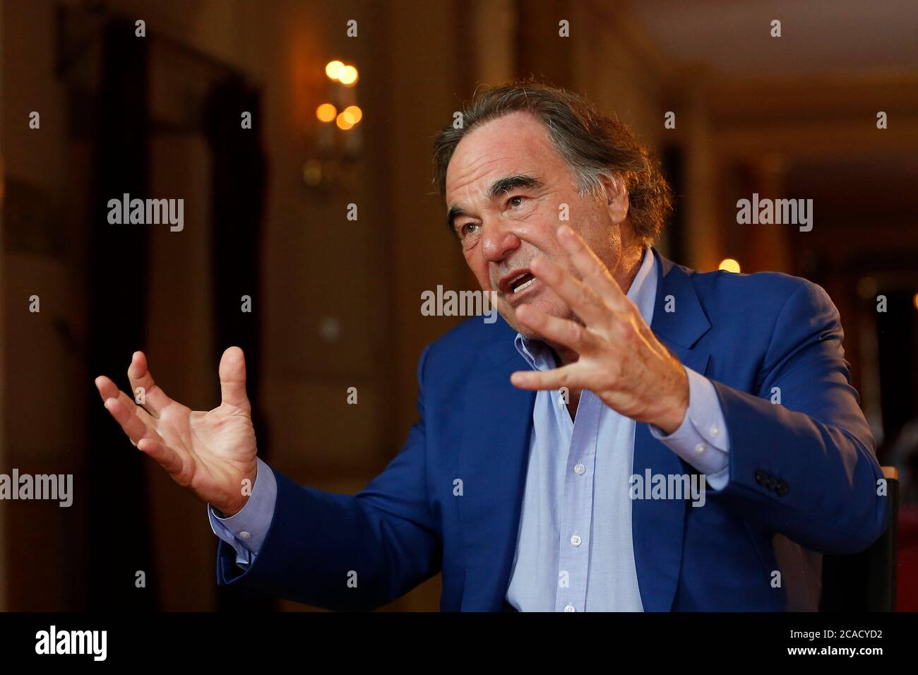 American screenwriter, film director, and producer Oliver Stone gesture ...