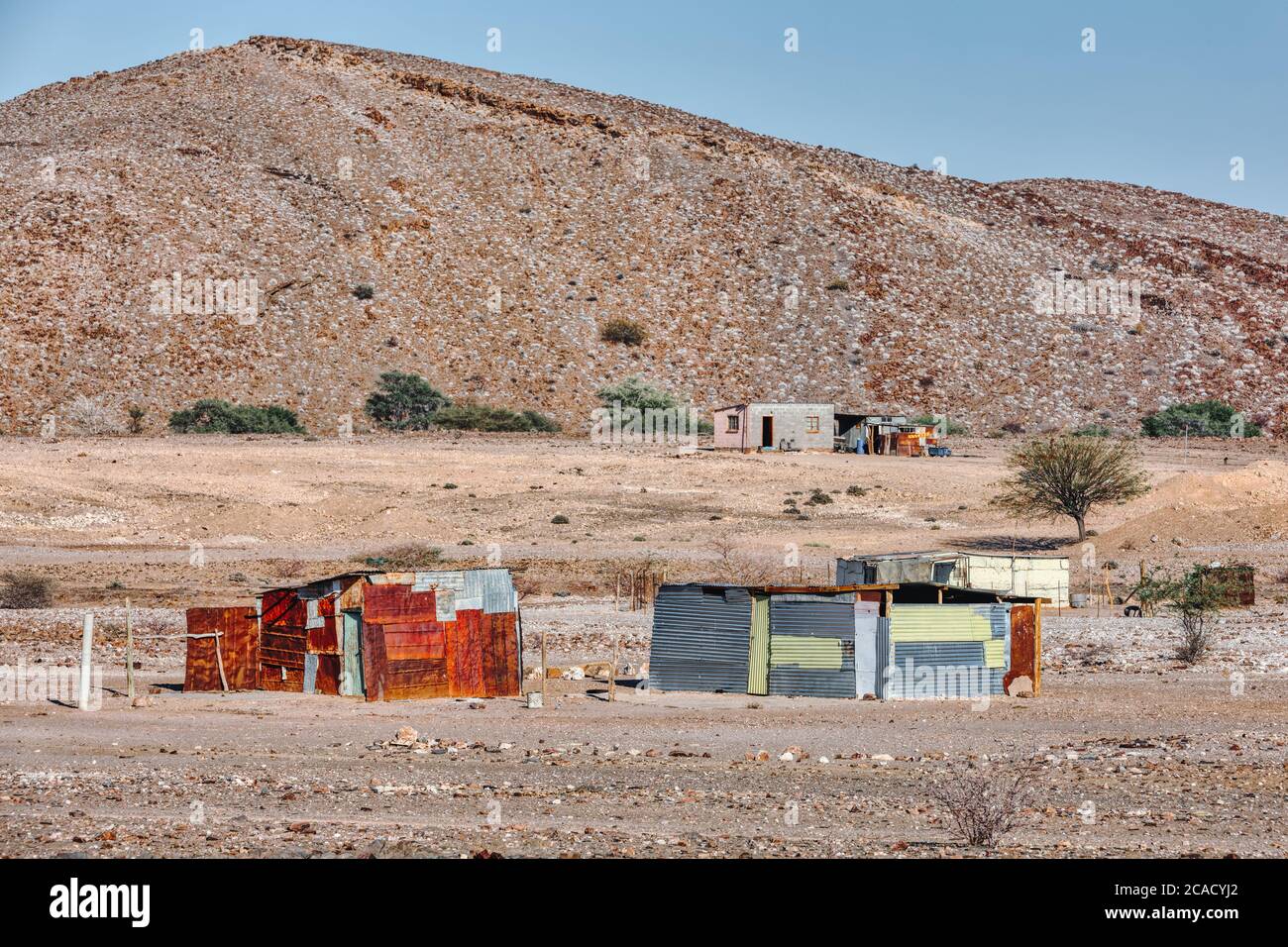 Traditional african hut from rusty sheet of tin in desert of Erongo ...