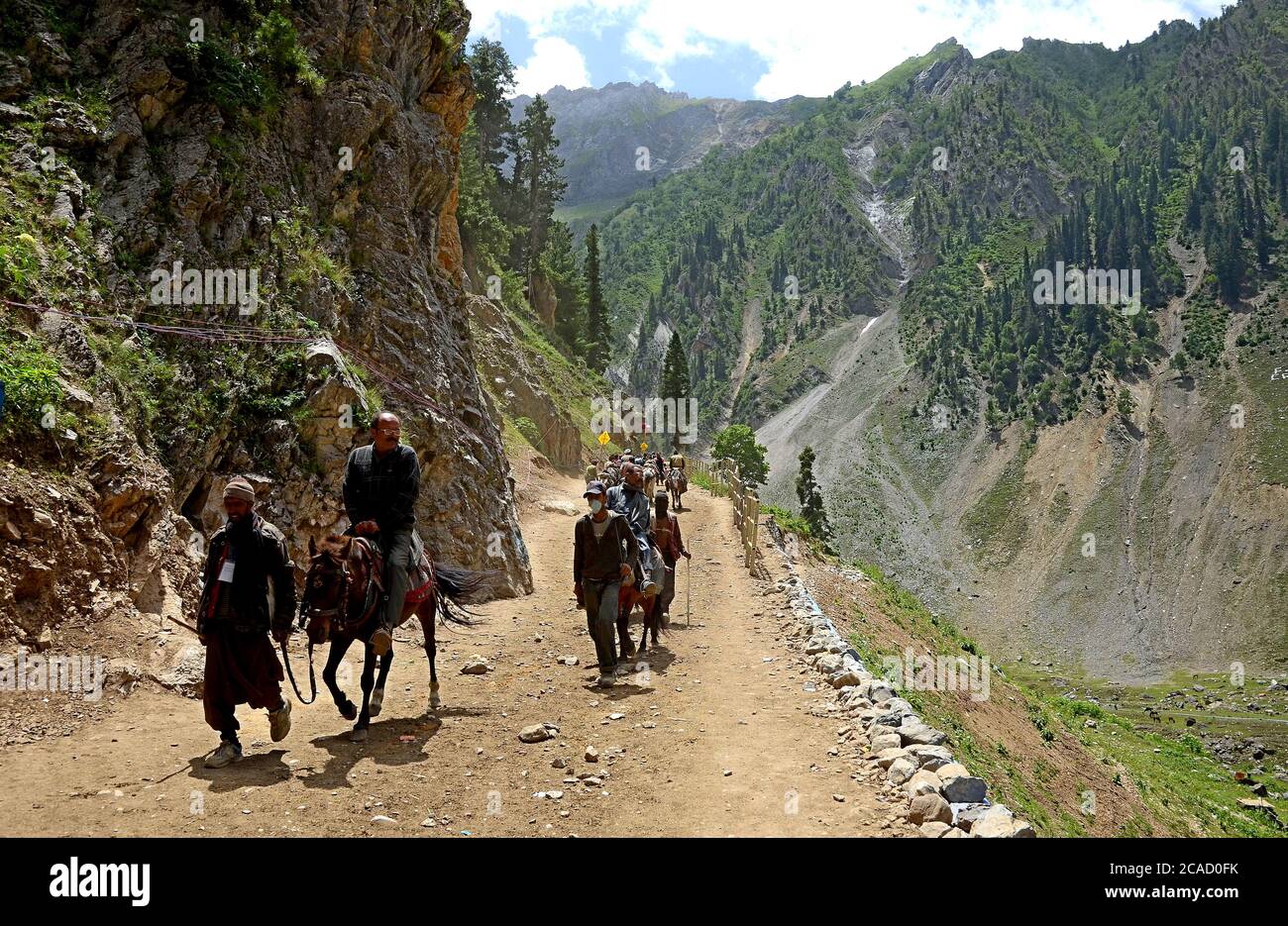 Hindu devotees visit during their pilgrimage from Baltal Base Camp to ...