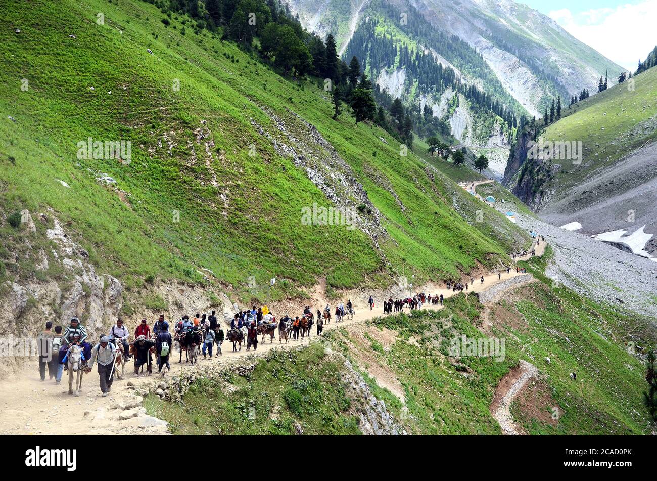 Hindu devotees visit during their pilgrimage from Baltal Base Camp to ...