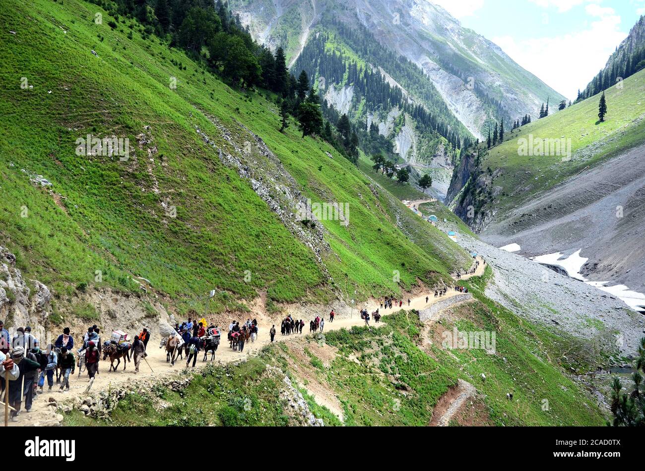 Hindu devotees visit during their pilgrimage from Baltal Base Camp to ...