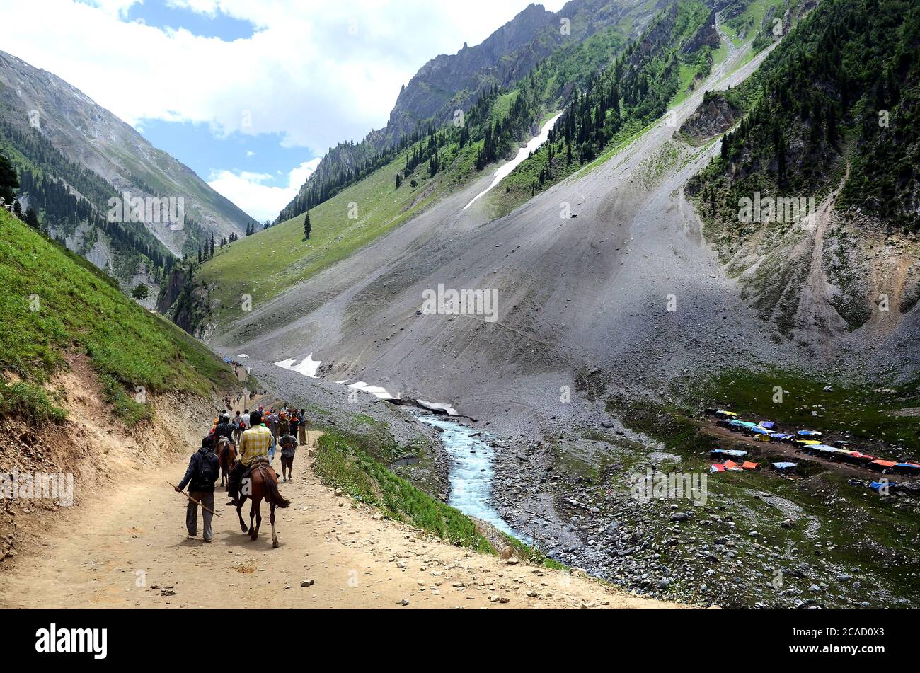 Hindu devotees visit during their pilgrimage from Baltal Base Camp to ...