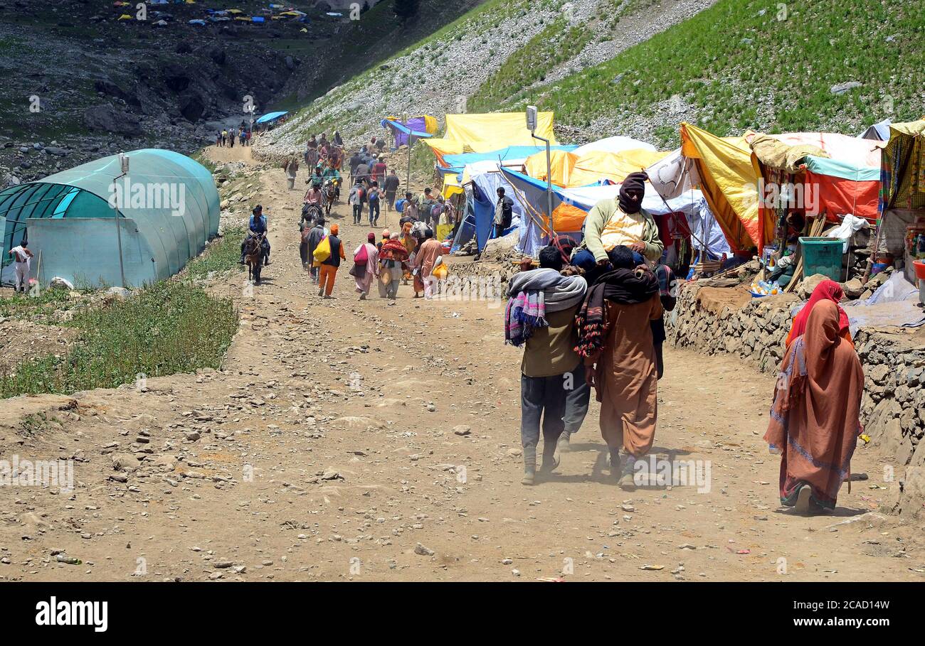 Hindu devotees visit during their pilgrimage from Baltal Base Camp to ...