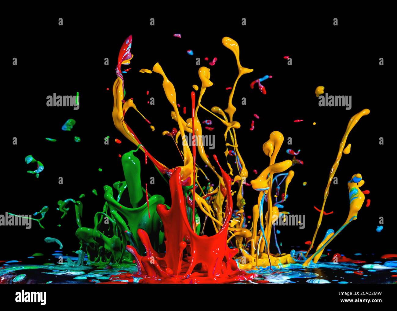 Explosion of multicolored paint caused by sound, on black background ...