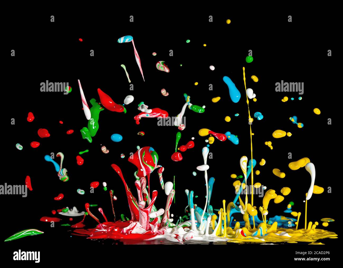 Explosion of multicolored paint caused by sound, on black background ...
