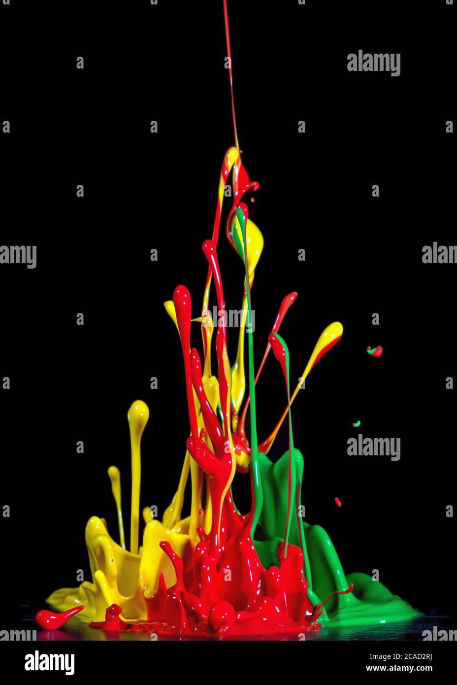 Explosion of multicolored paint caused by sound, on black background ...