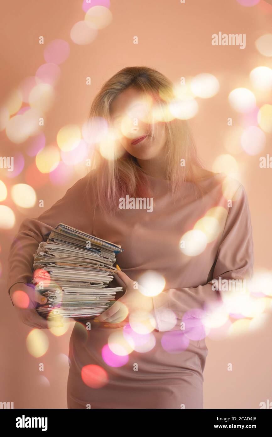 Lovely girl holding copybooks in her hands. Portrait with copy space ...