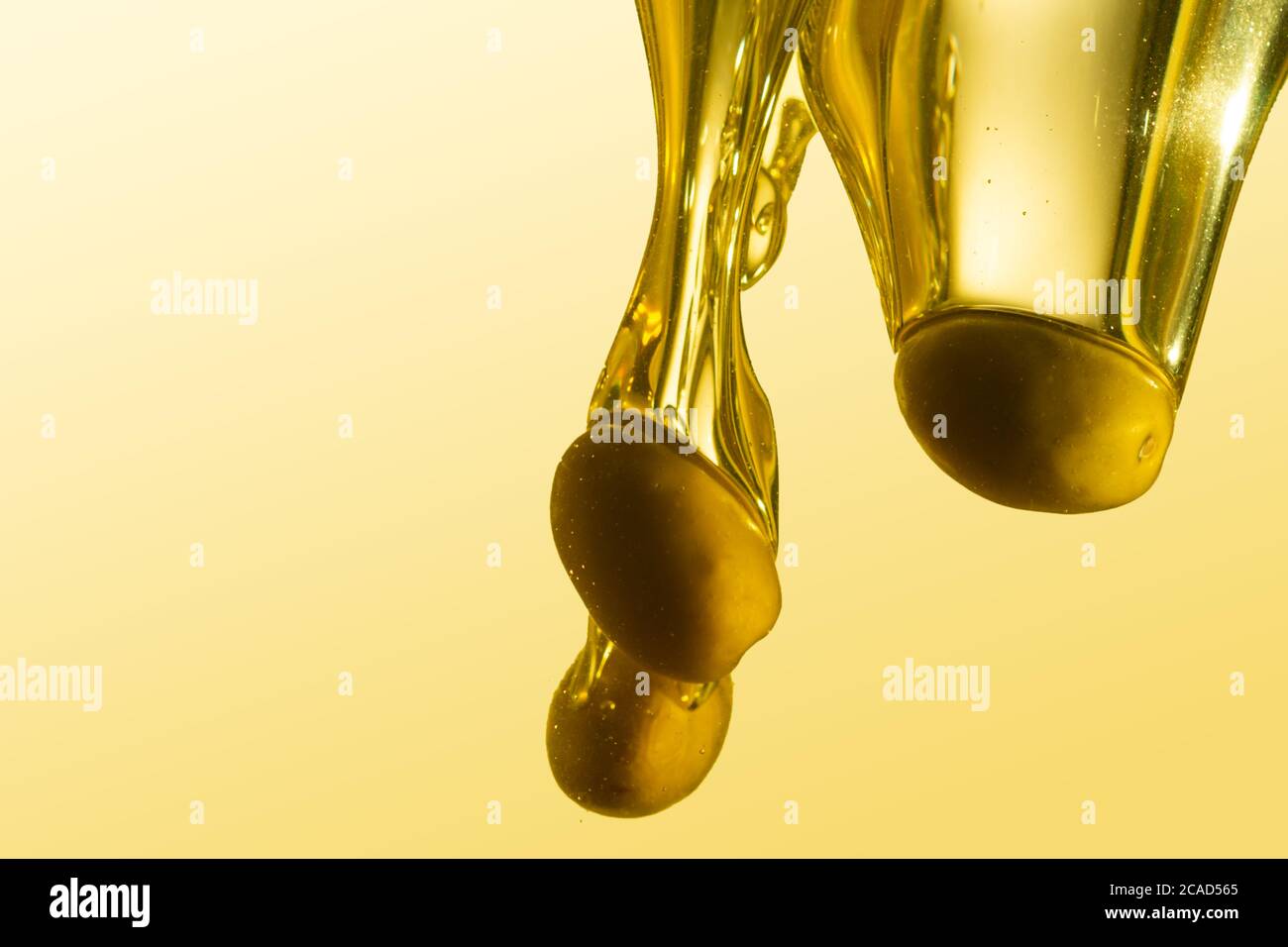 Green olives falling in olive oil forming a splash Stock Photo - Alamy