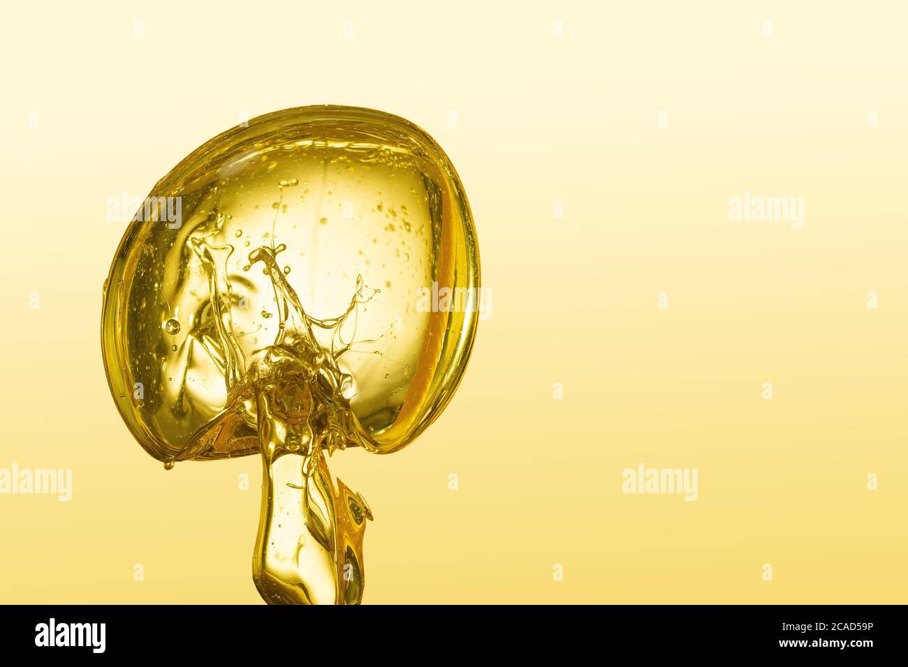 Green olives falling in olive oil forming a splash Stock Photo - Alamy