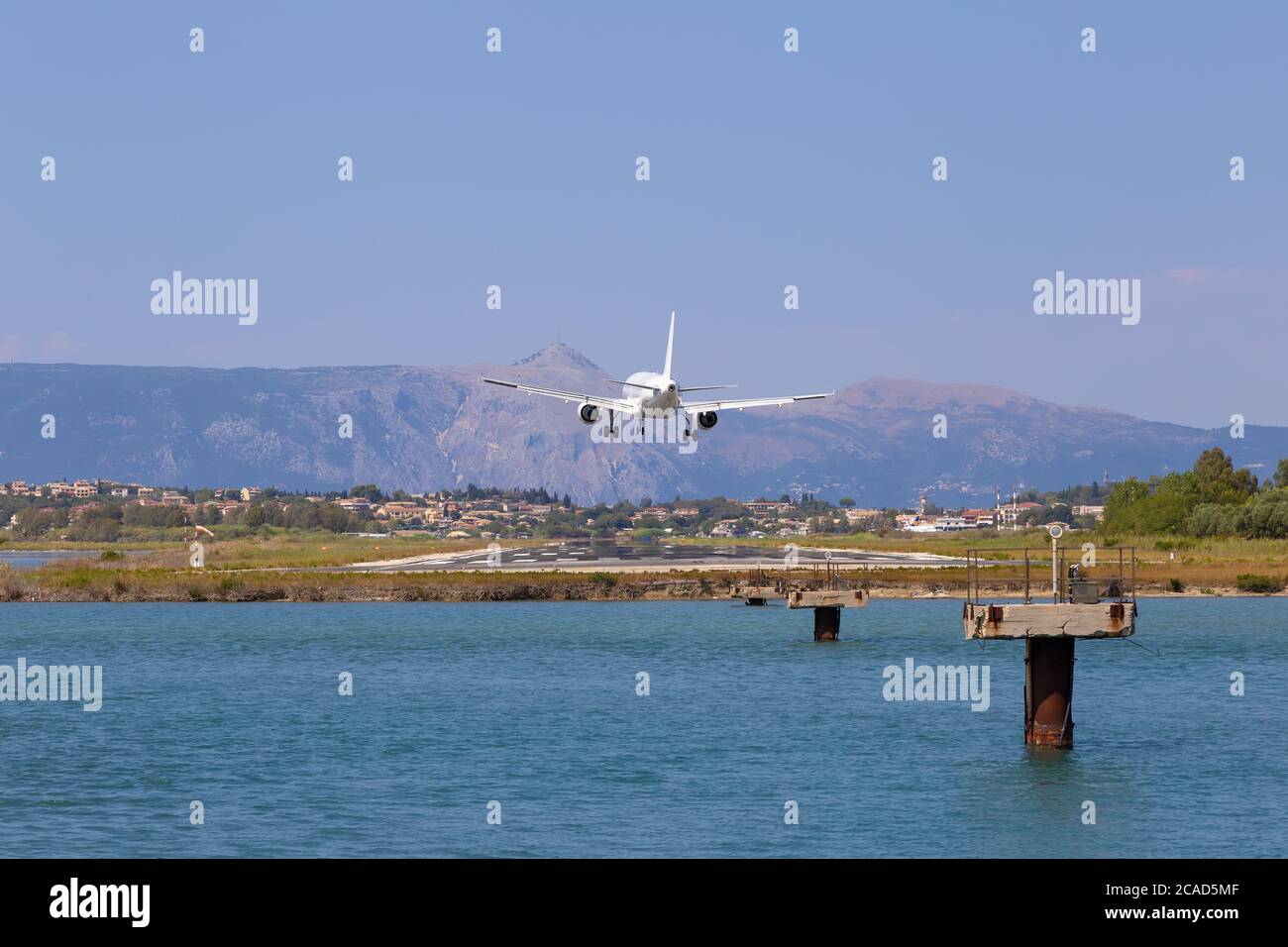 Airplane on an airport landing strip hi-res stock photography and ...
