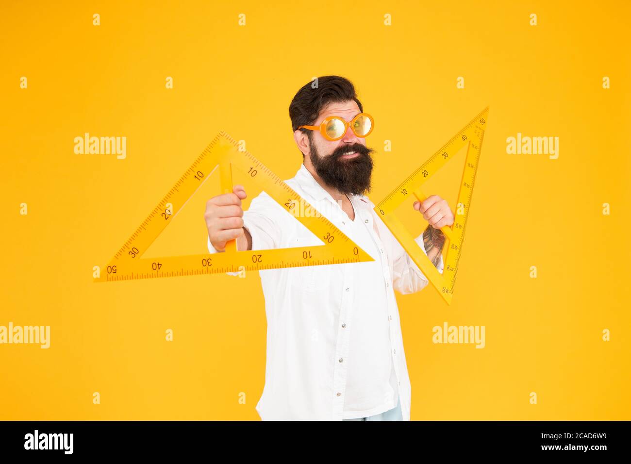Man math lesson. Bearded nerd triangle. Geometry teacher. Student using ...