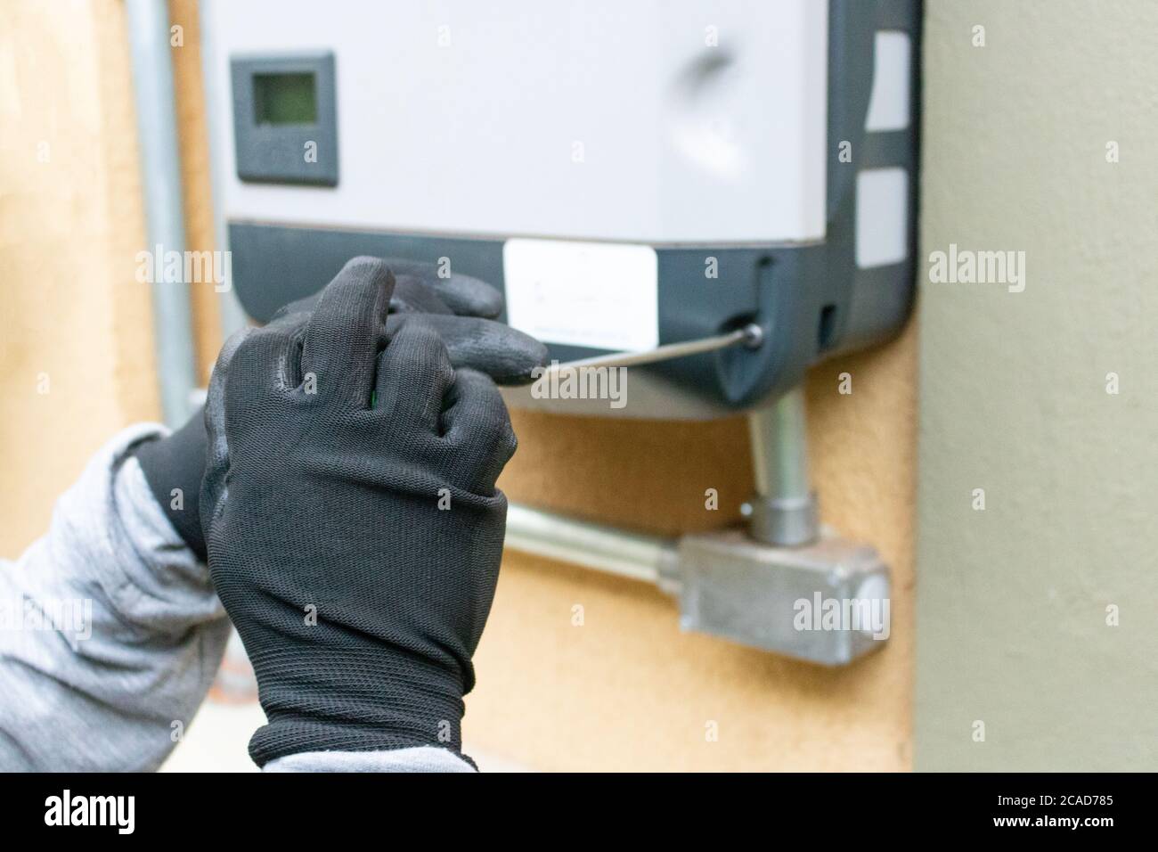 Cleaning and maintenance of the solar inverter Stock Photo - Alamy