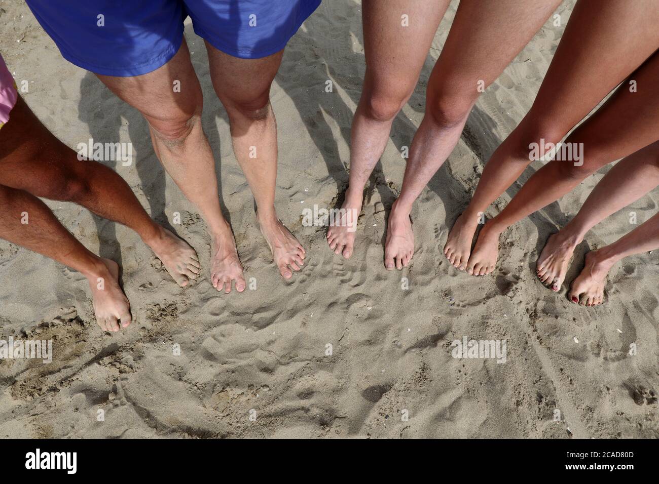 ten feet of a family of five on the sandy beach in summer Stock Photo ...