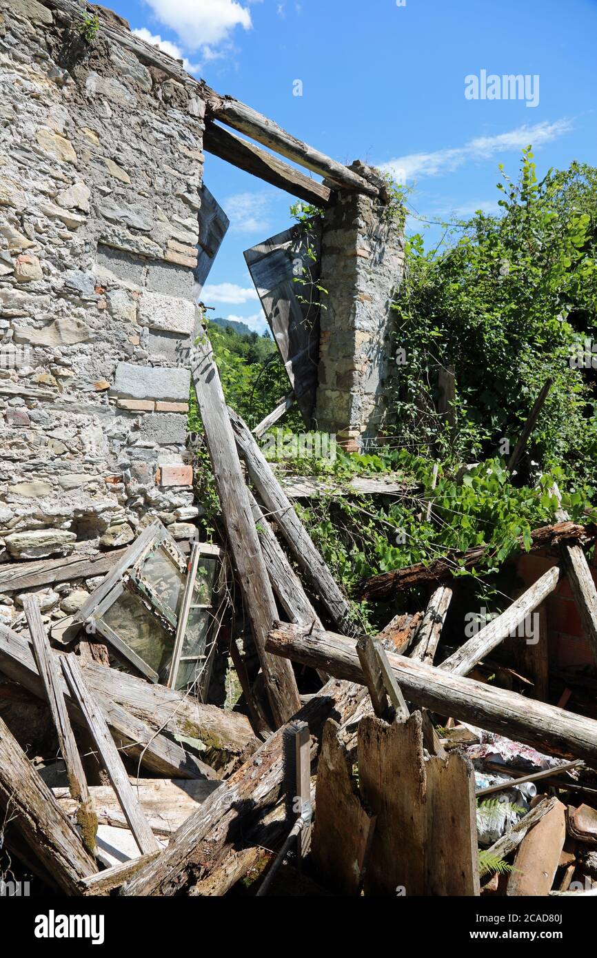 destroyed house with broken walls and old wooden planks after the ...