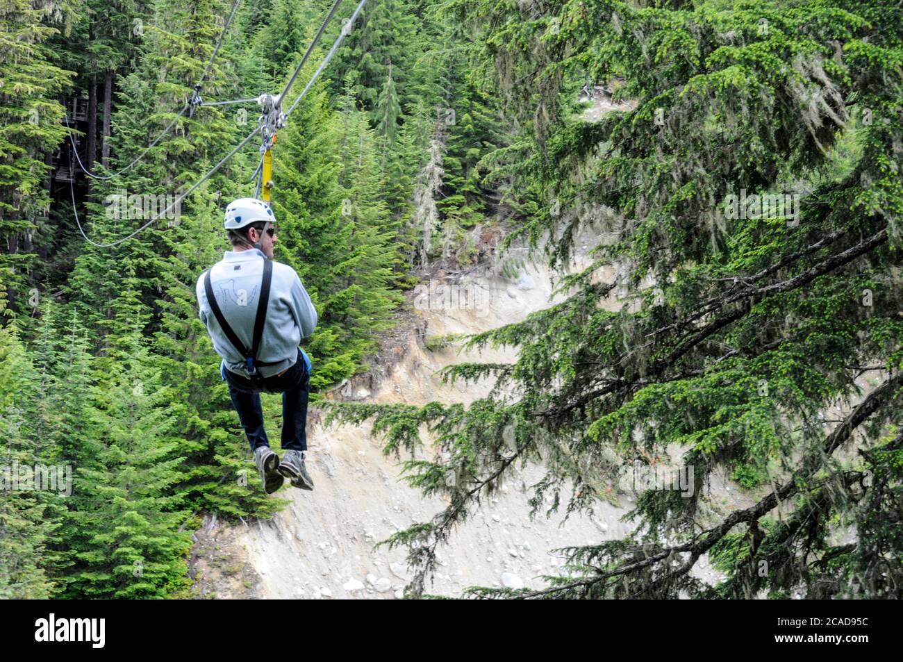 A tourist takes a higher and faster ride on the zip wire above the ...