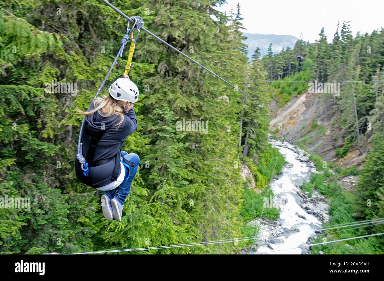 A tourist takes a higher and faster ride on the zip wire above the ...