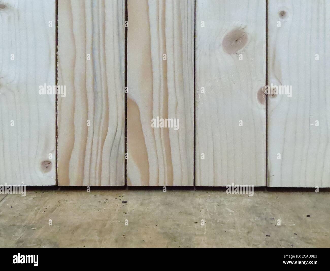 Low angle shot of the bottom of a wooden door with vertical docks Stock ...
