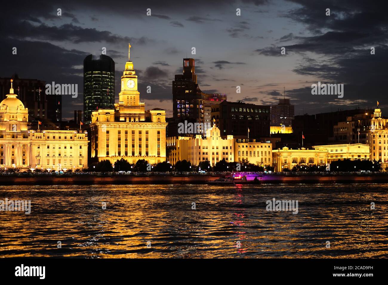 Beautiful sunset at the bund in Shanghai. Golden western buildings ...