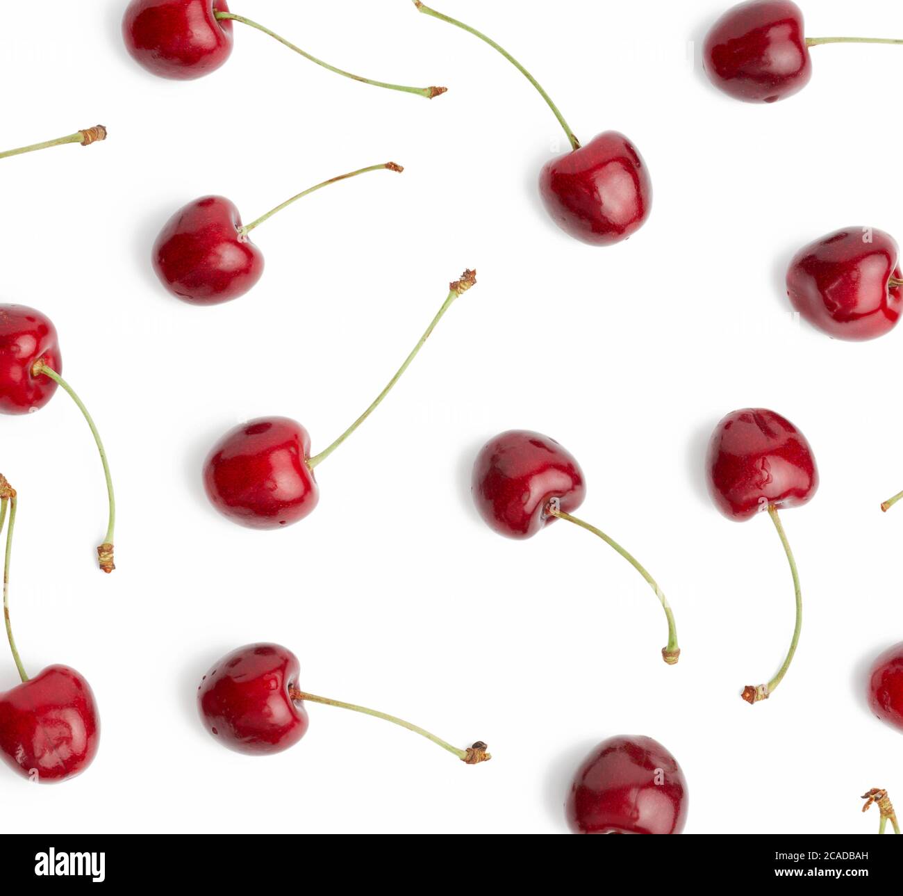 whole ripe red juicy sweet cherries isolated on a white background, top ...