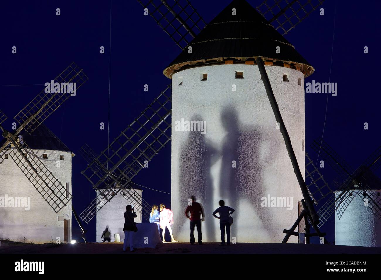 People throw their shadows on historical wind mill Stock Photo - Alamy