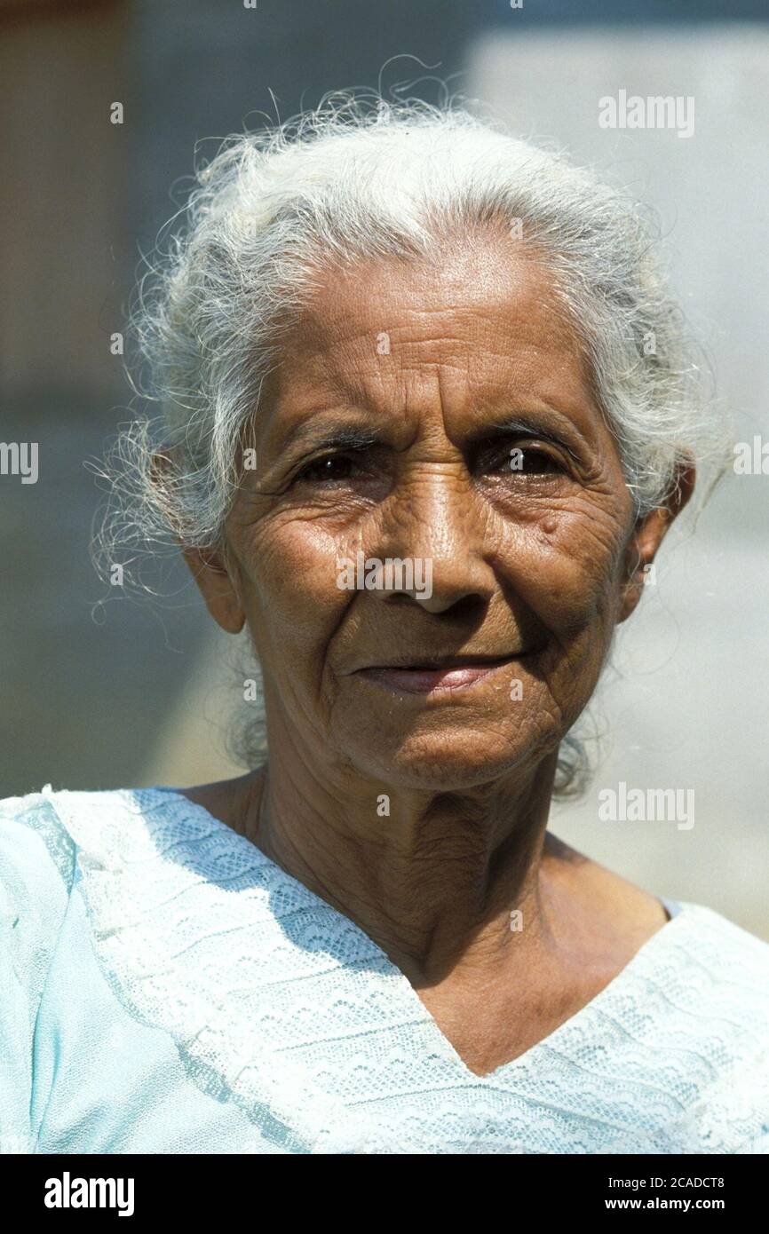 Elderly Hispanic woman poses for portrait in Copan Ruinas, Honduras ...
