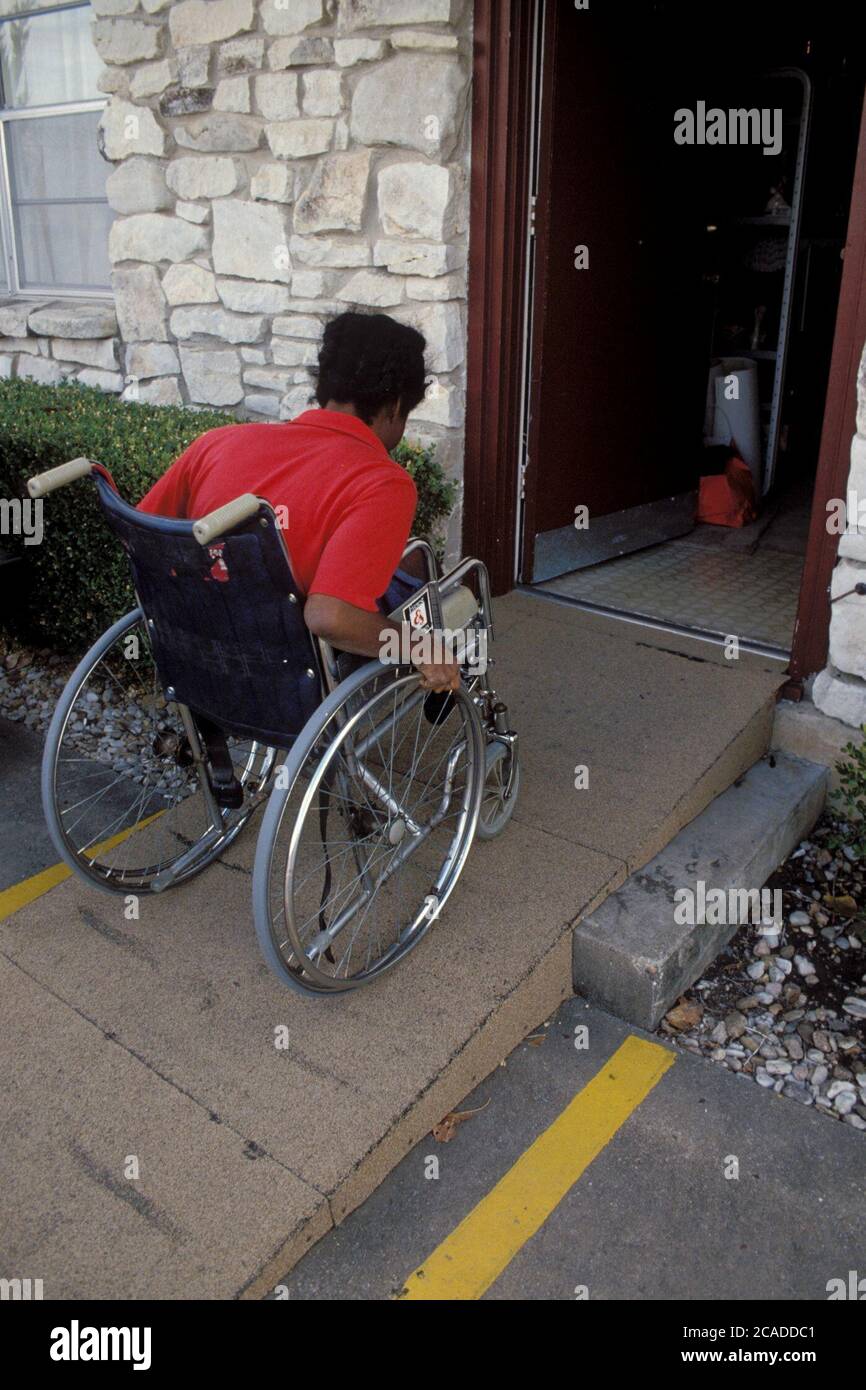 Disabled African-American woman uses wheelchair ramp in Austin, Texas ...