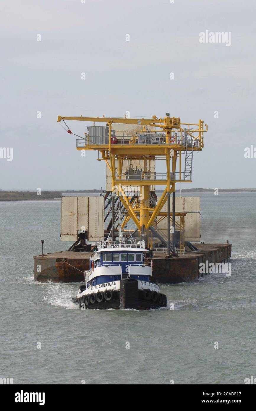 Port Aransas, Texas USA, January 15, 2006: A barge carrying a shallow ...