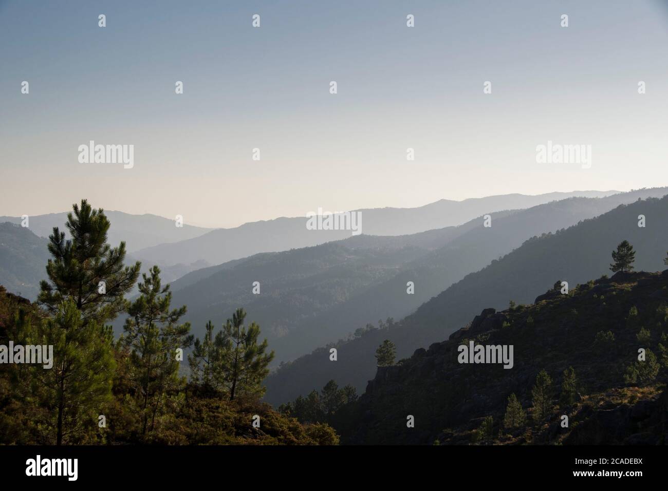 Mountain ranges fading and vanishing way in the distance at sunset ...