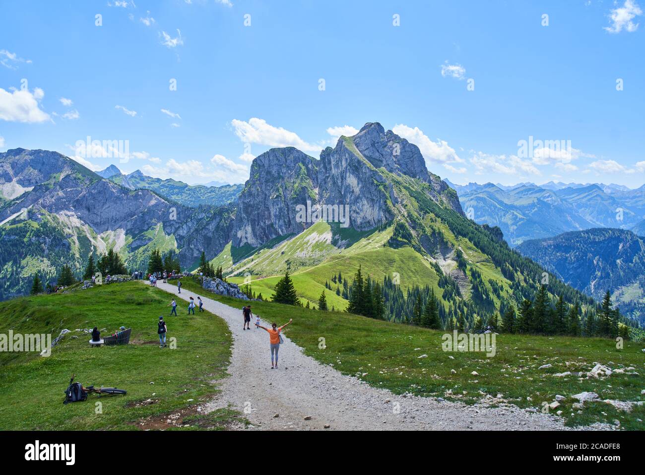 Pfronten, Germany, 28th July 2020, Hiker, mountain biker and paraglider ...