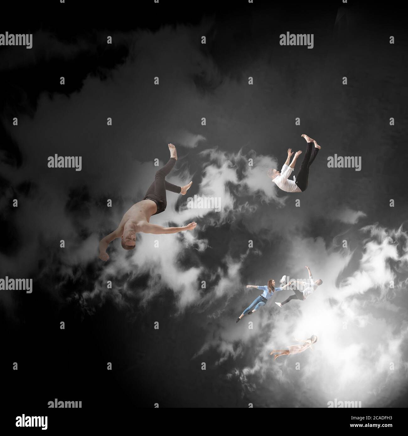 Mid-air beauty cought in clouds. Full length shot of attractive young ...