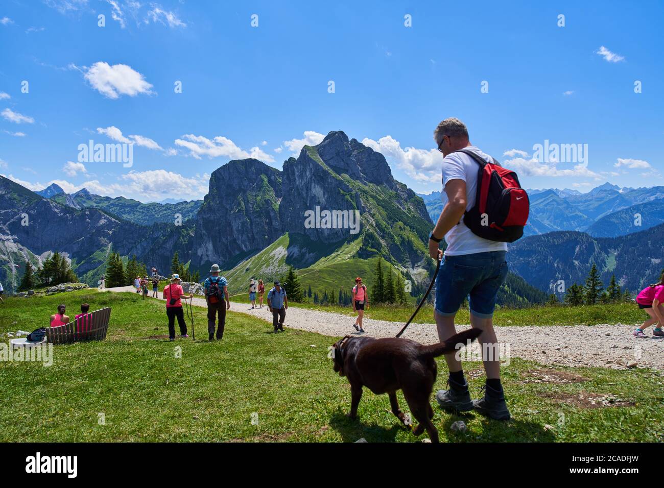 Pfronten, Germany, 28th July 2020, Hiker, mountain biker and paraglider ...